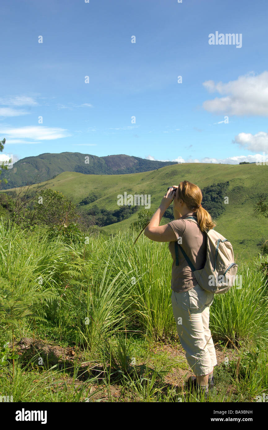 A tourist is taken on a guided bird walk in Zimbabwe's Bvumba Mountains ...