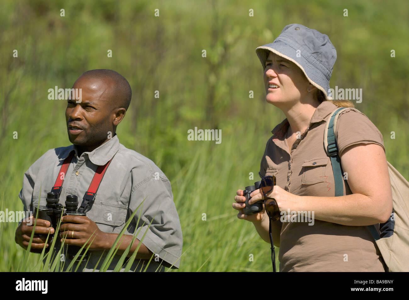 A tourist is taken on a guided bird walk in Zimbabwe's Bvumba Mountains ...