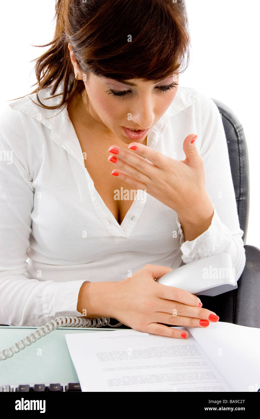 front view of shocked female looking papers Stock Photo - Alamy