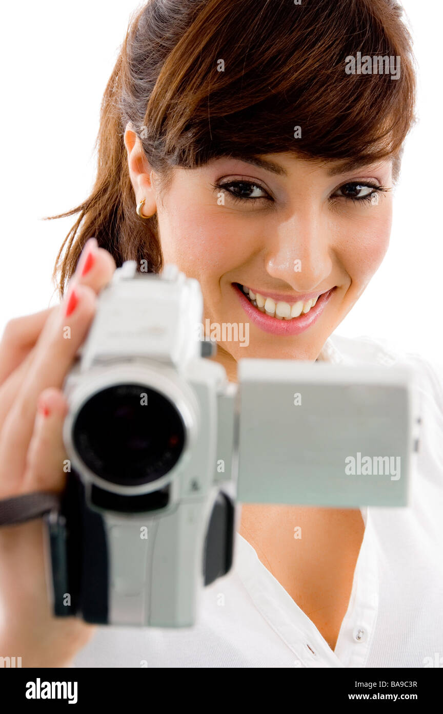 front view of smiling female holding video camera Stock Photo - Alamy