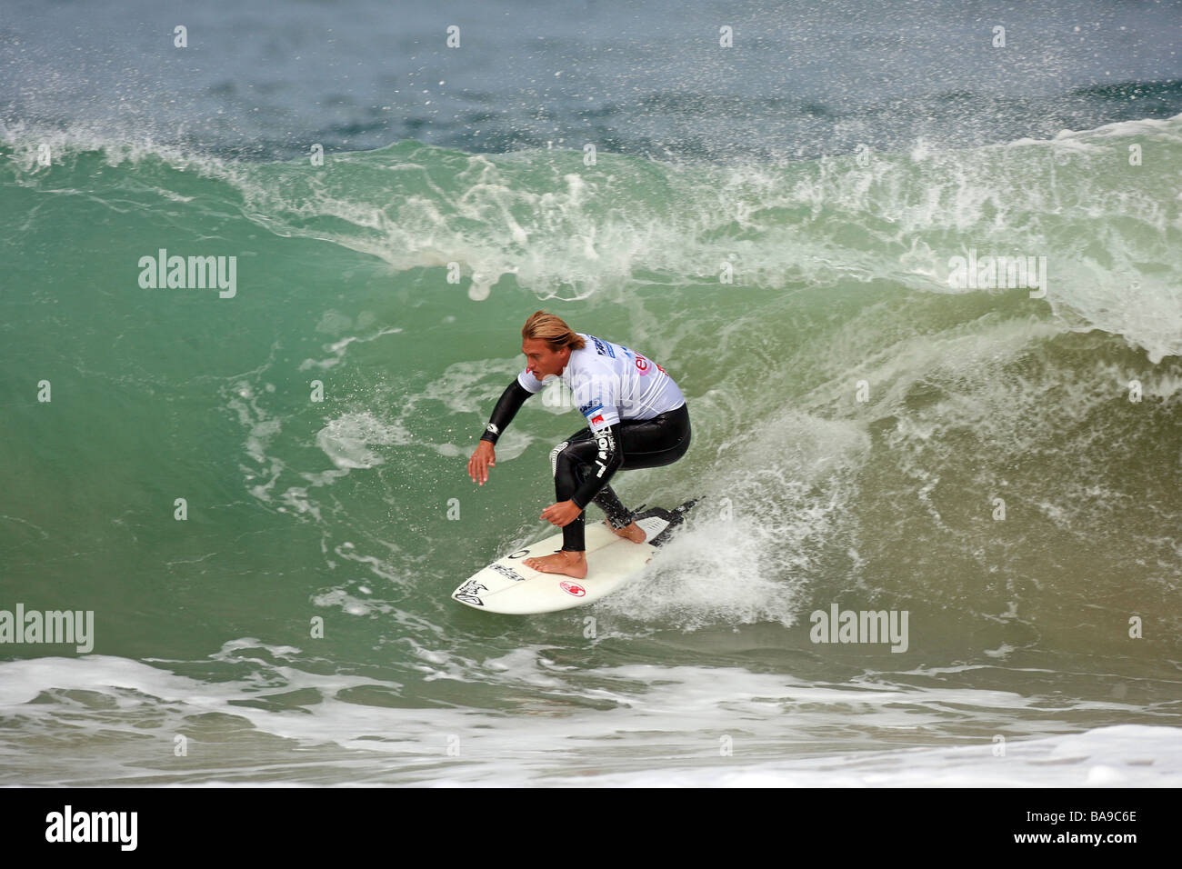 A Surfer surfing on a wave Stock Photo - Alamy