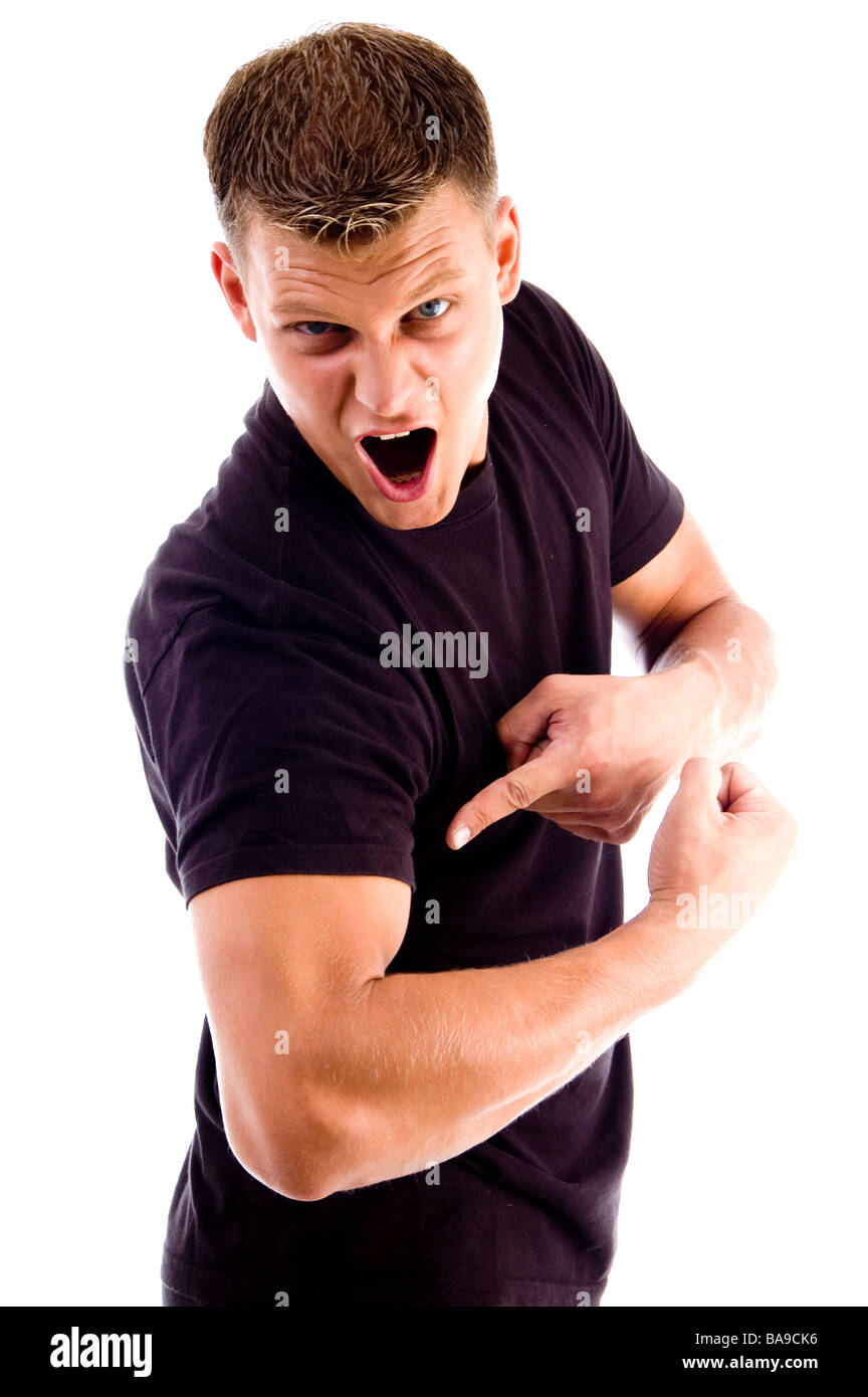 shouting man pointing at his muscles Stock Photo - Alamy