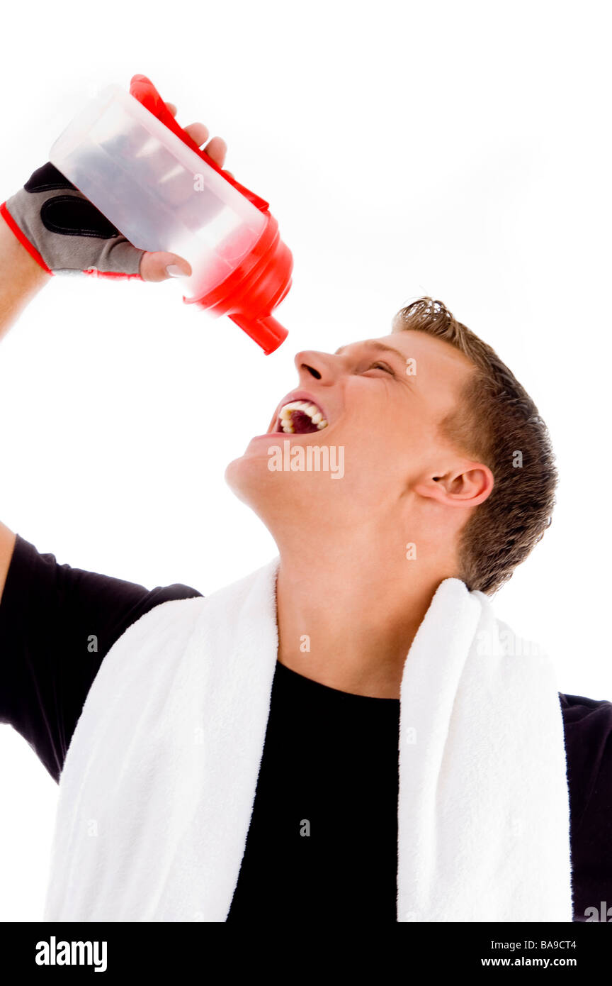 portrait of muscular man drinking from water bottle Stock Photo - Alamy