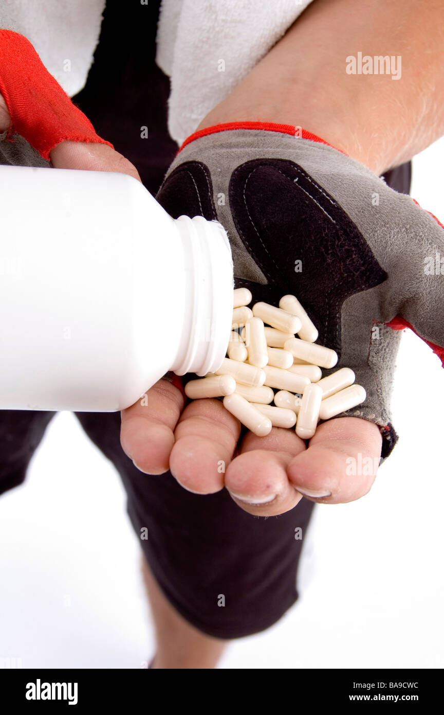 man taking capsules on hand Stock Photo - Alamy
