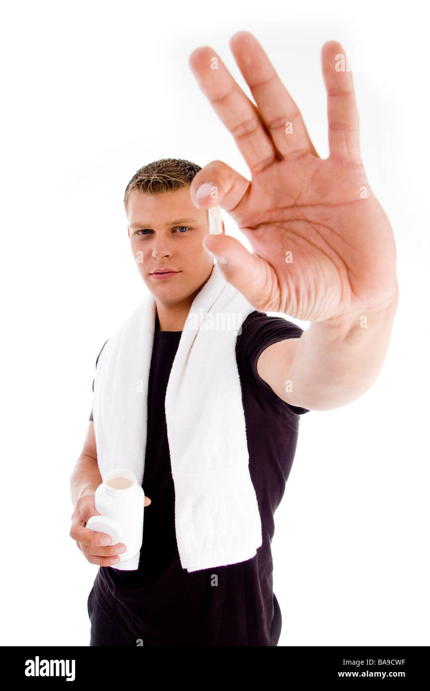 muscular male holding medicine Stock Photo - Alamy