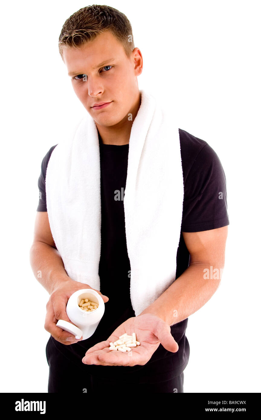 muscular man showing medicine in his palm Stock Photo - Alamy