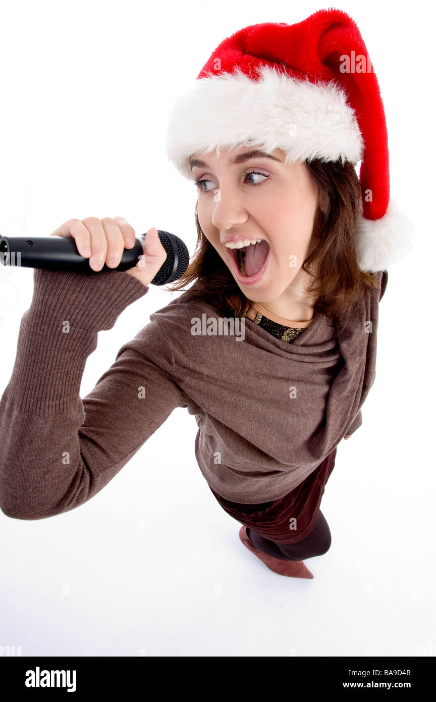 teen singer with mic and christmas hat Stock Photo - Alamy