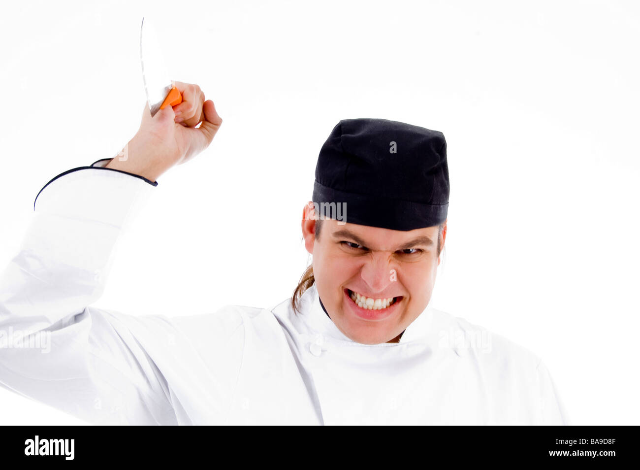 male chef attacking with knife Stock Photo - Alamy