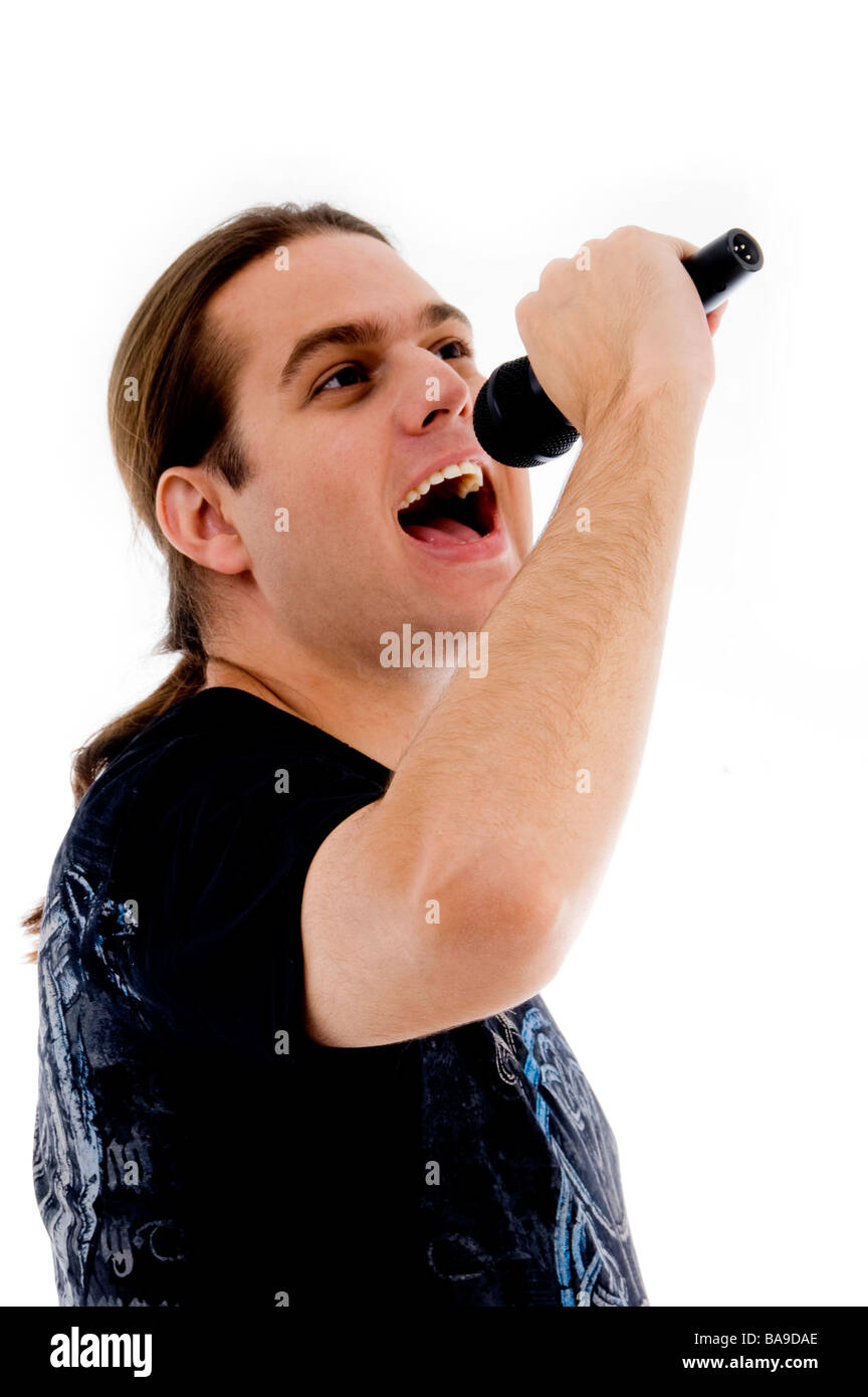 young male singing into microphone Stock Photo - Alamy