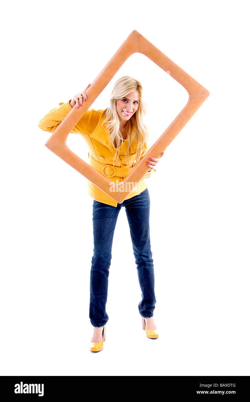front view of smiling model posing with frame Stock Photo - Alamy