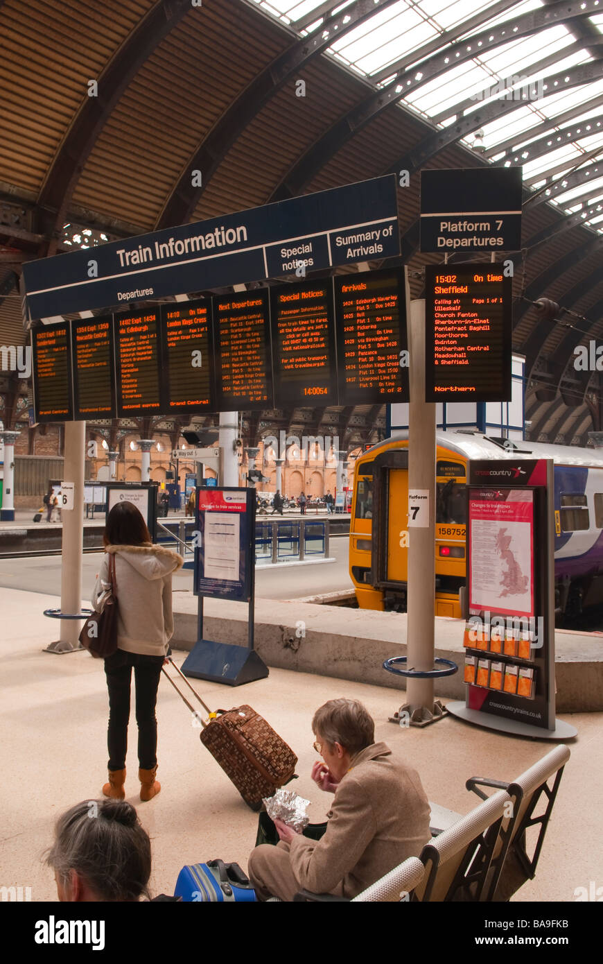 A view from above of commuters and the interior of the busy train ...
