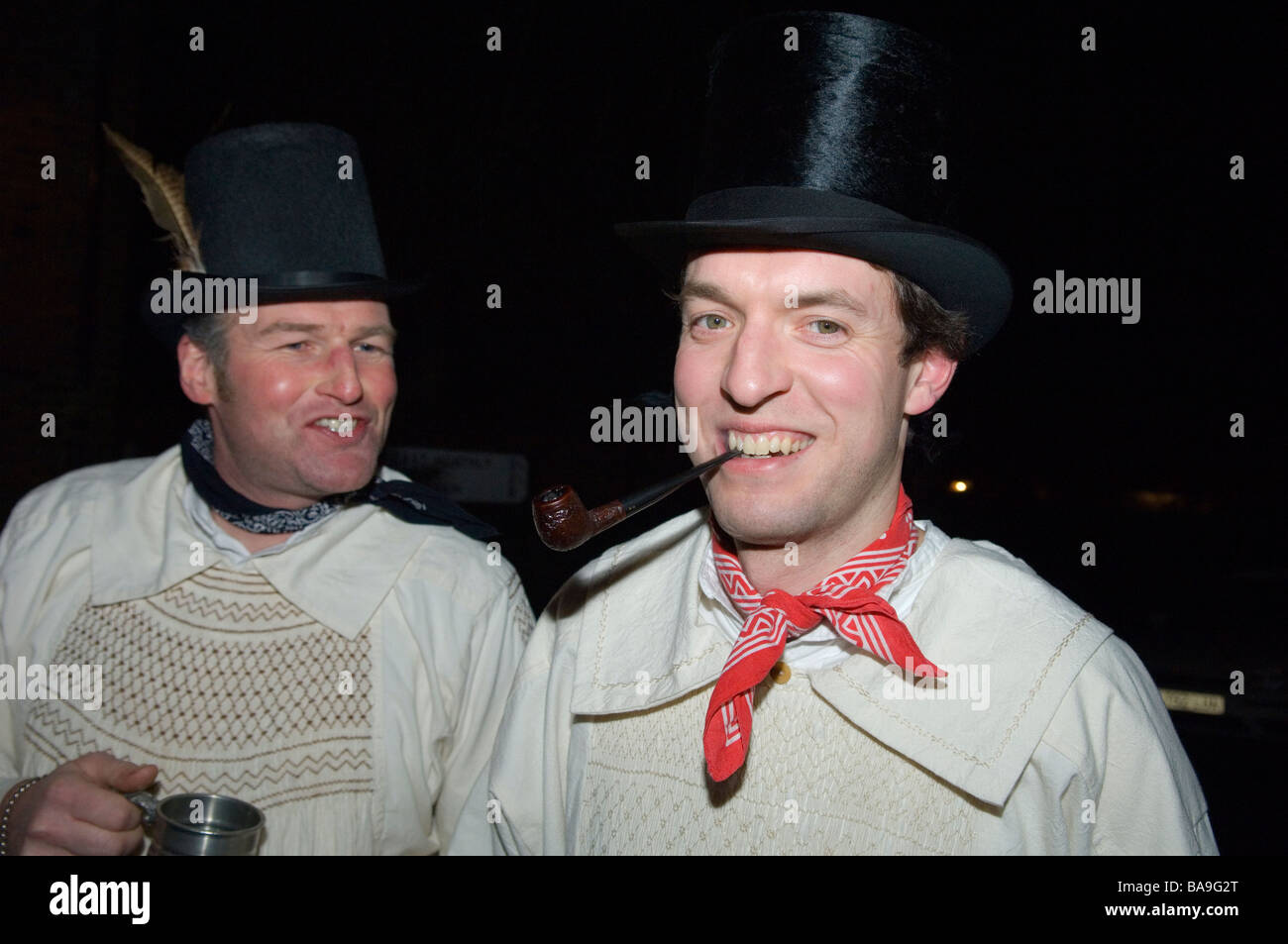 Two men wearing traditional smocks at an East Sussex wassailing event ...