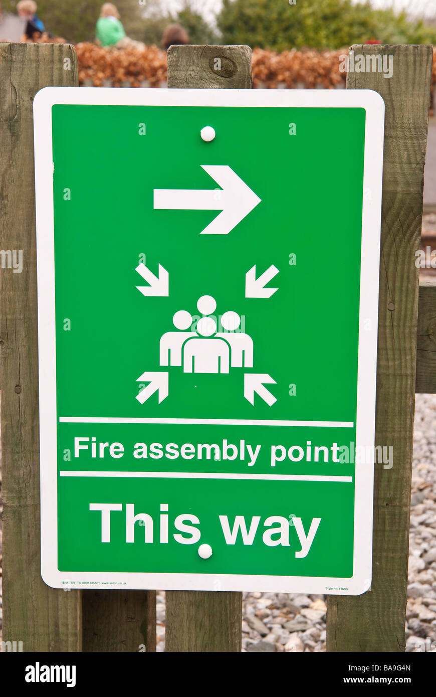 Fire assembly point this way sign in the uk Stock Photo - Alamy