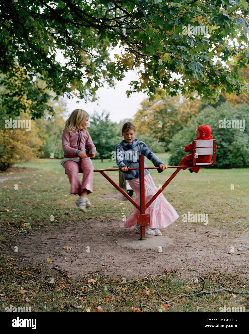 Three girls playing in a playground, Sweden Stock Photo - Alamy