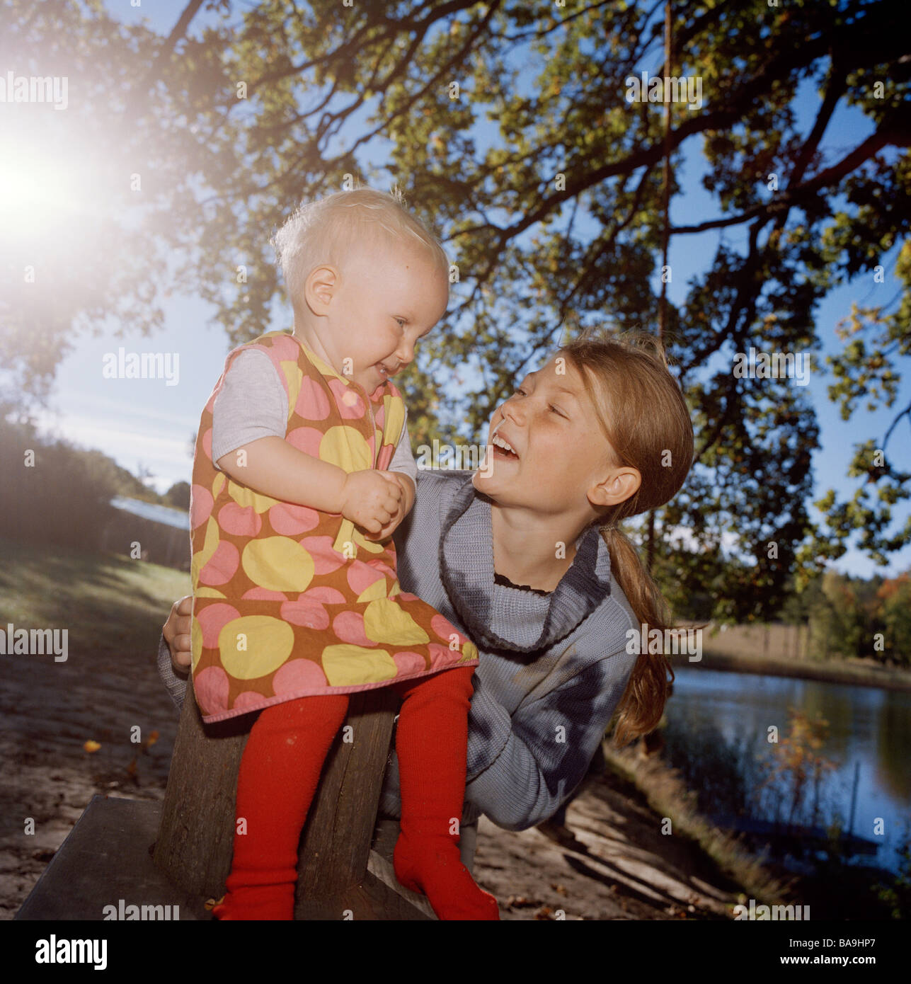 Two laughing girls, Tindered, Smaland, Sweden Stock Photo - Alamy