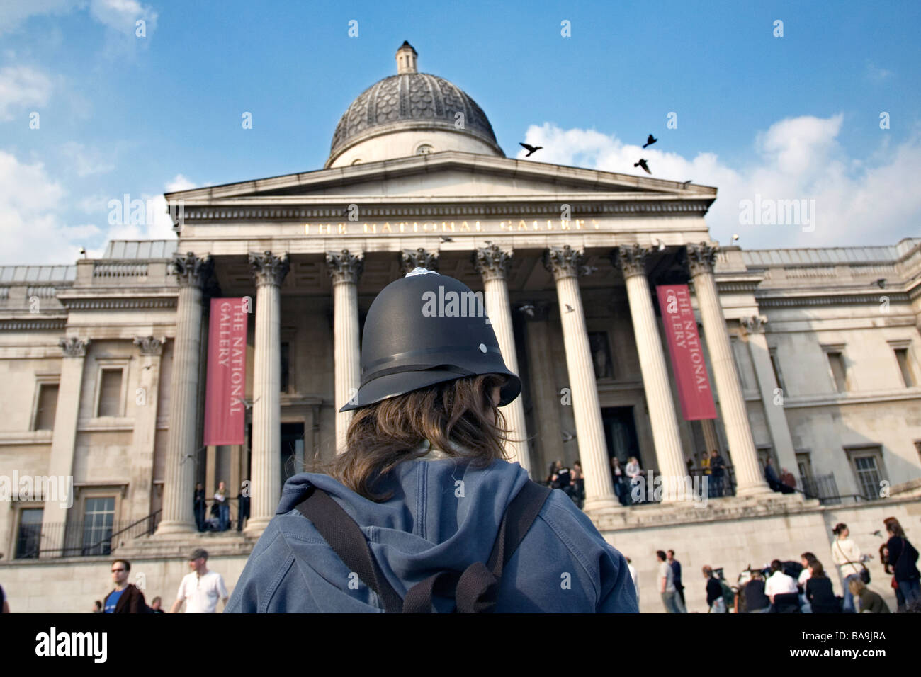 a tourist wearing a fake police hat in london Stock Photo - Alamy
