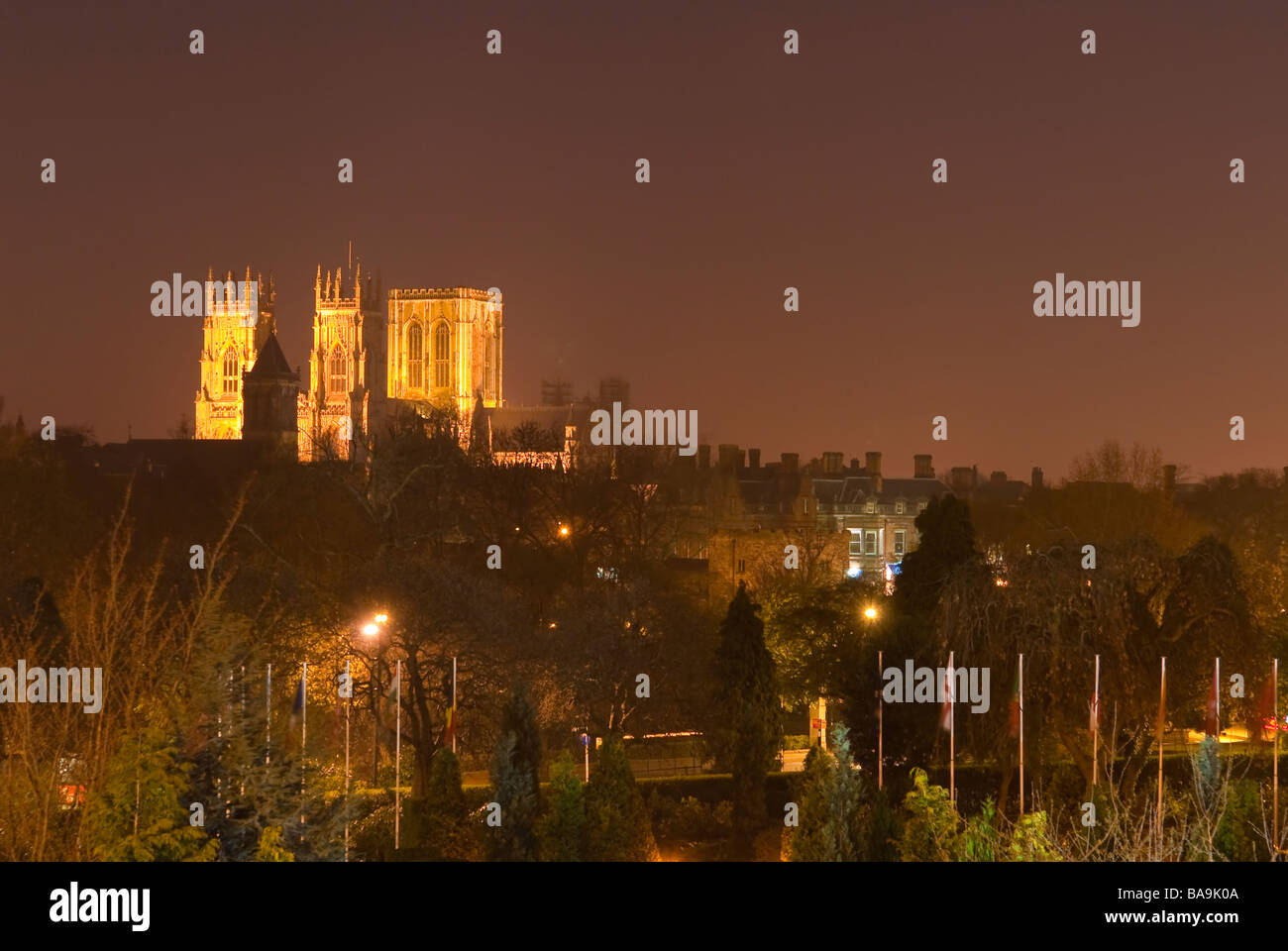 A cityscape view of Yorkminster cathedral lit up at night in York ...