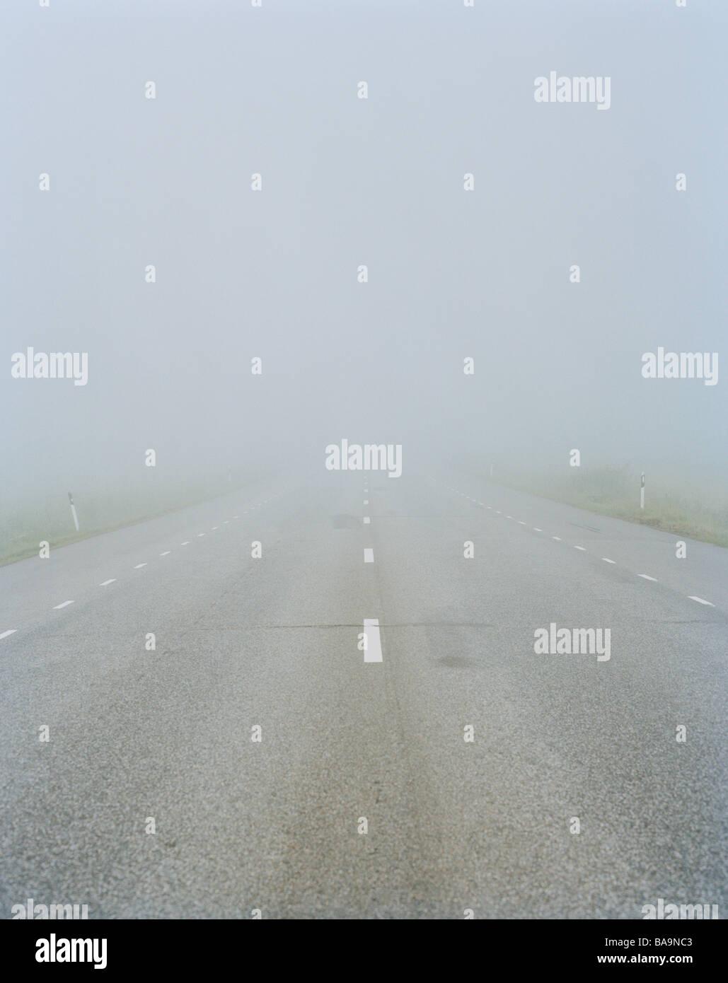 Road shrouded in dense fog Stock Photo - Alamy