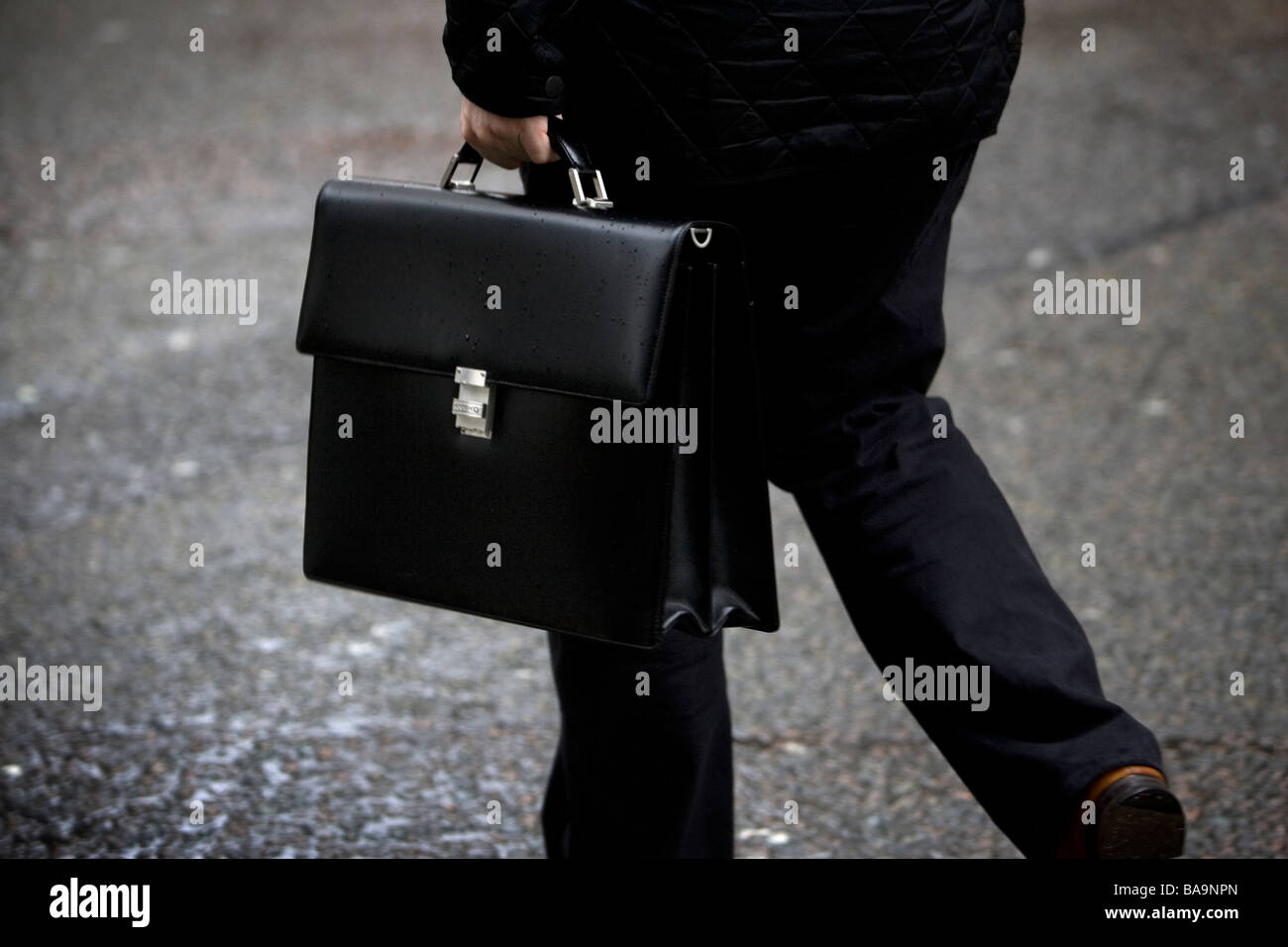 Close crop of a man with a briefcase in London Stock Photo - Alamy