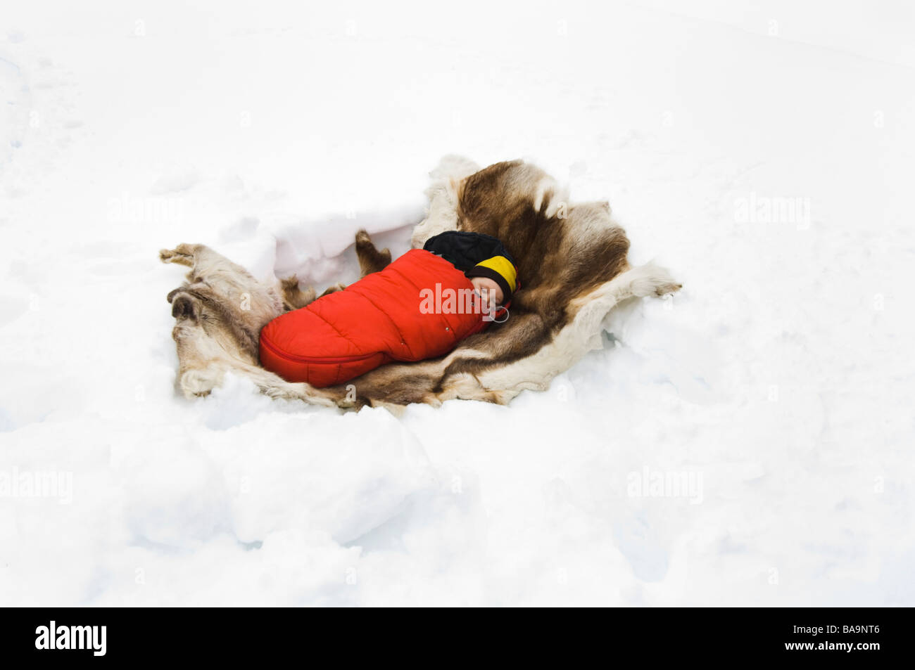 A baby sleeping in a sleepingbag in the snow Sweden Stock Photo - Alamy
