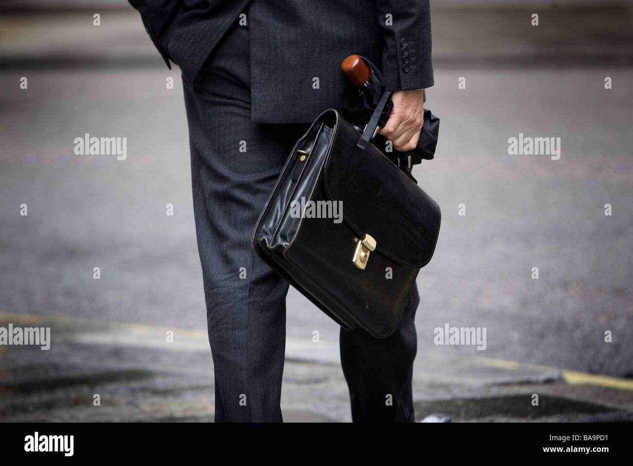 Close crop of a man with a briefcase in London Stock Photo - Alamy