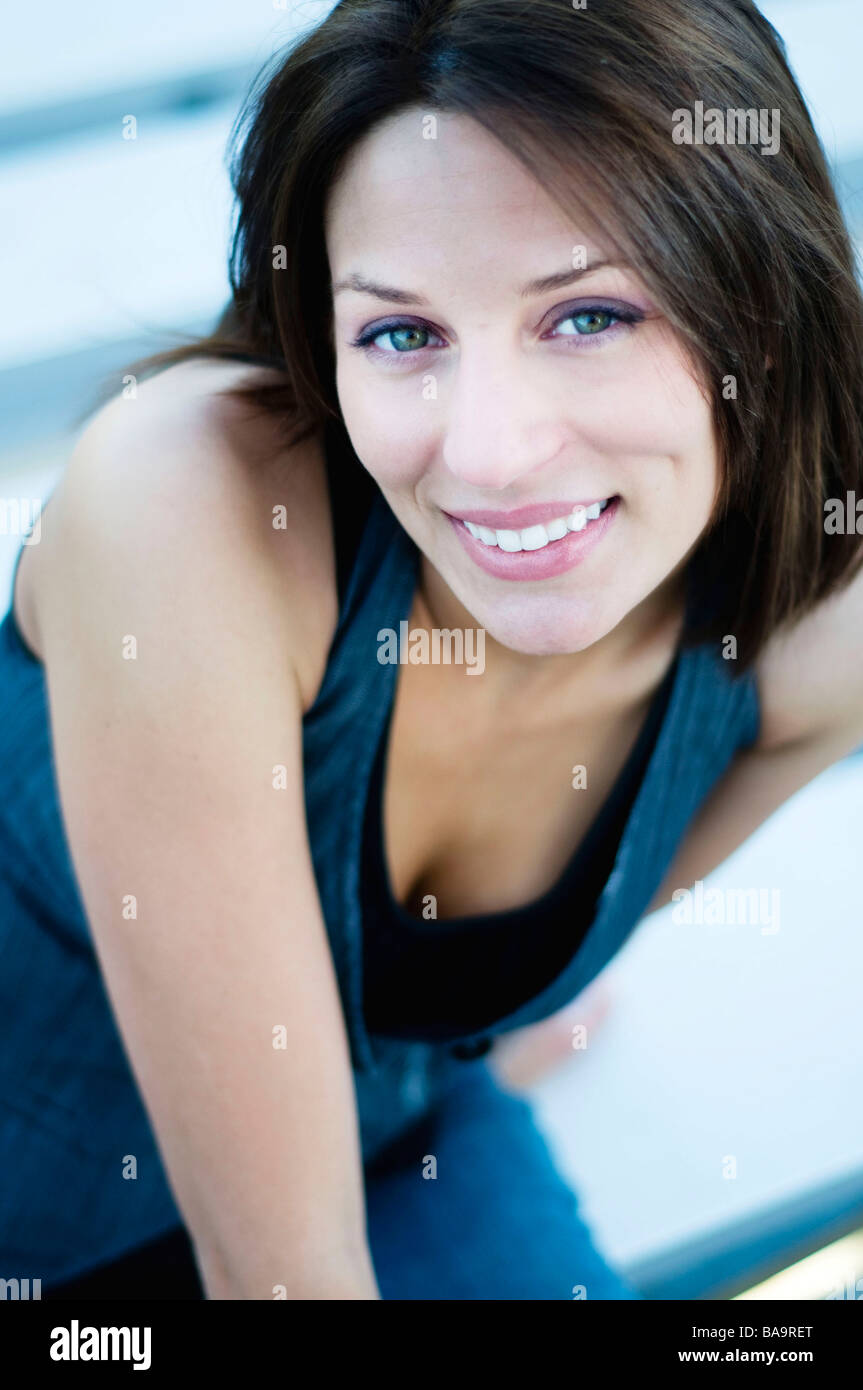 Outdoor portrait photo of an attractive young woman with a kind ...