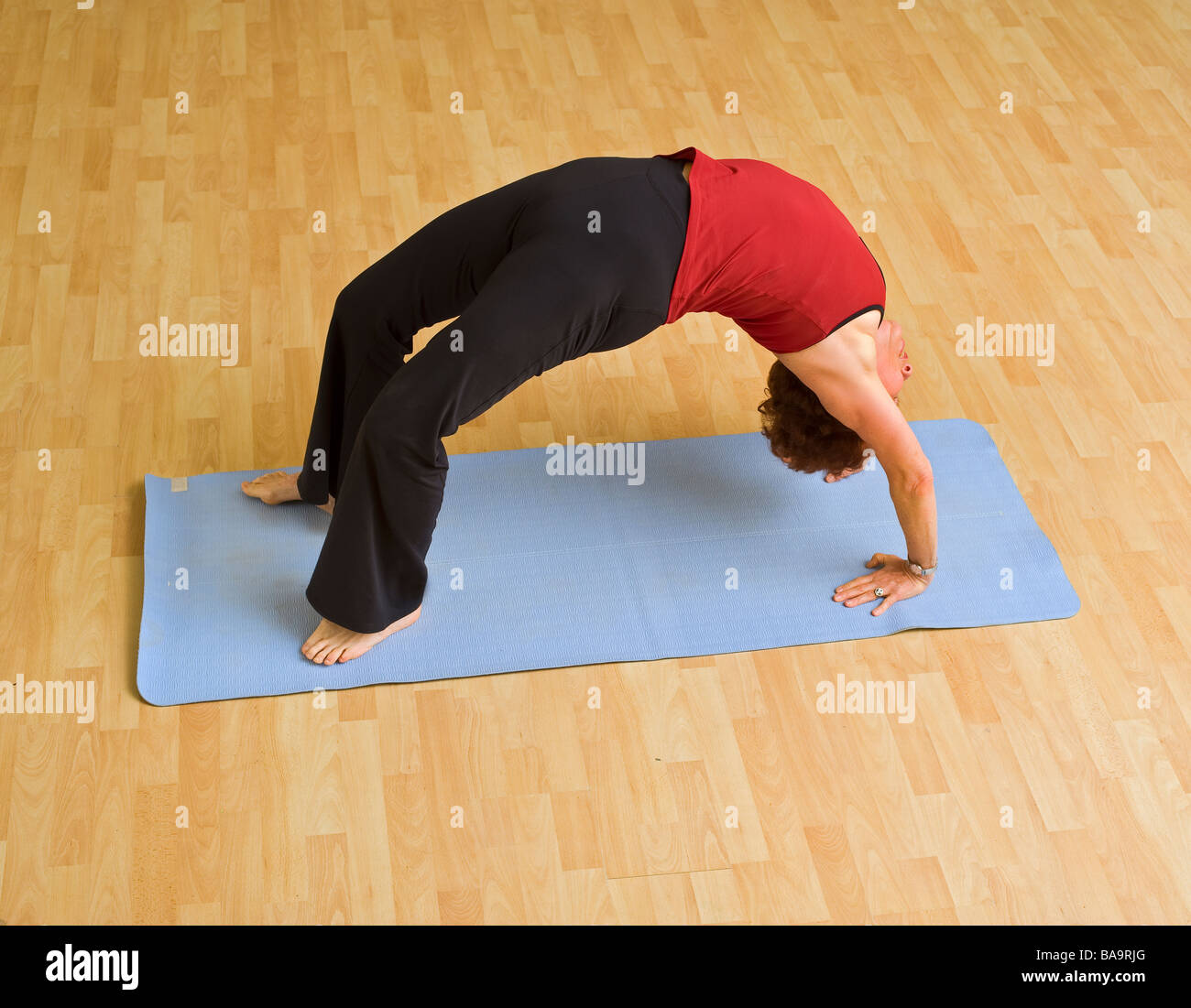 Senior woman exercising doing bridge hi-res stock photography and ...