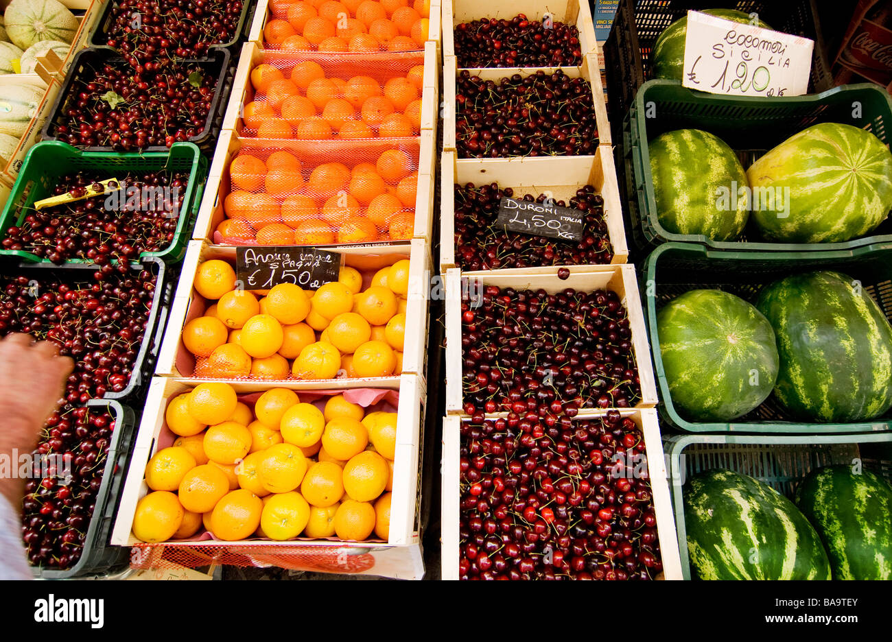 photograph of fruit stall selling cherries oranges and melons Stock ...