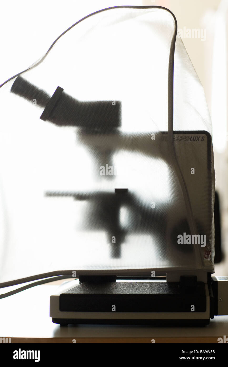 A microscope covered by plastic Stock Photo - Alamy