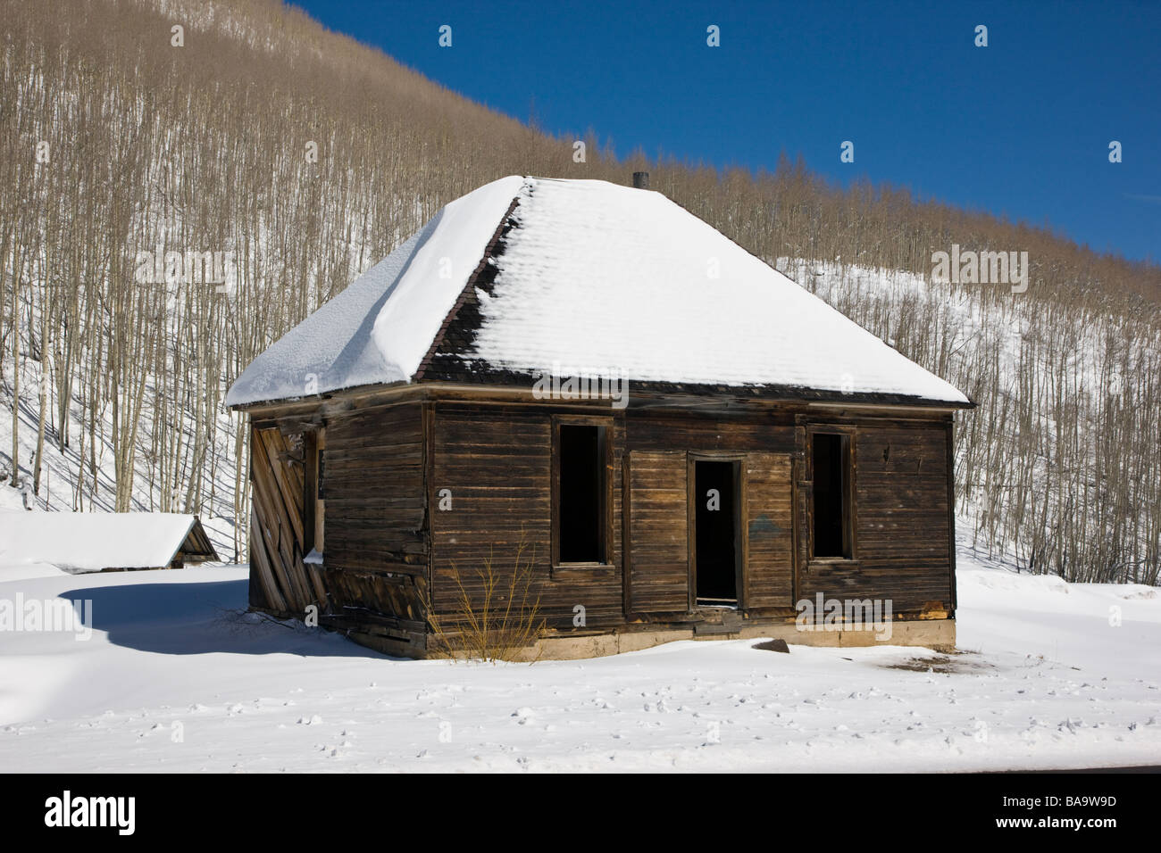 Winter view of an historic mining cabin on the Million Dollar Highway ...