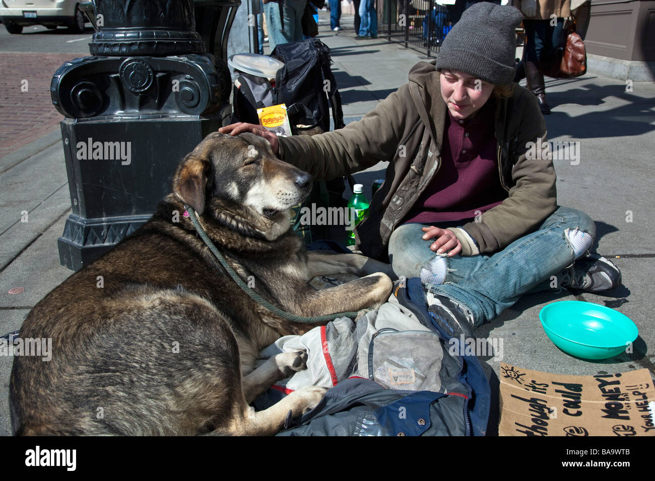 Homeless young woman with dog Stock Photo - Alamy
