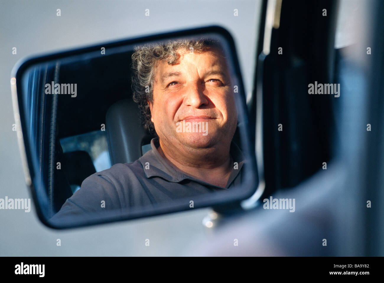 Reflection of 1 one man or person in wing mirror hi-res stock ...