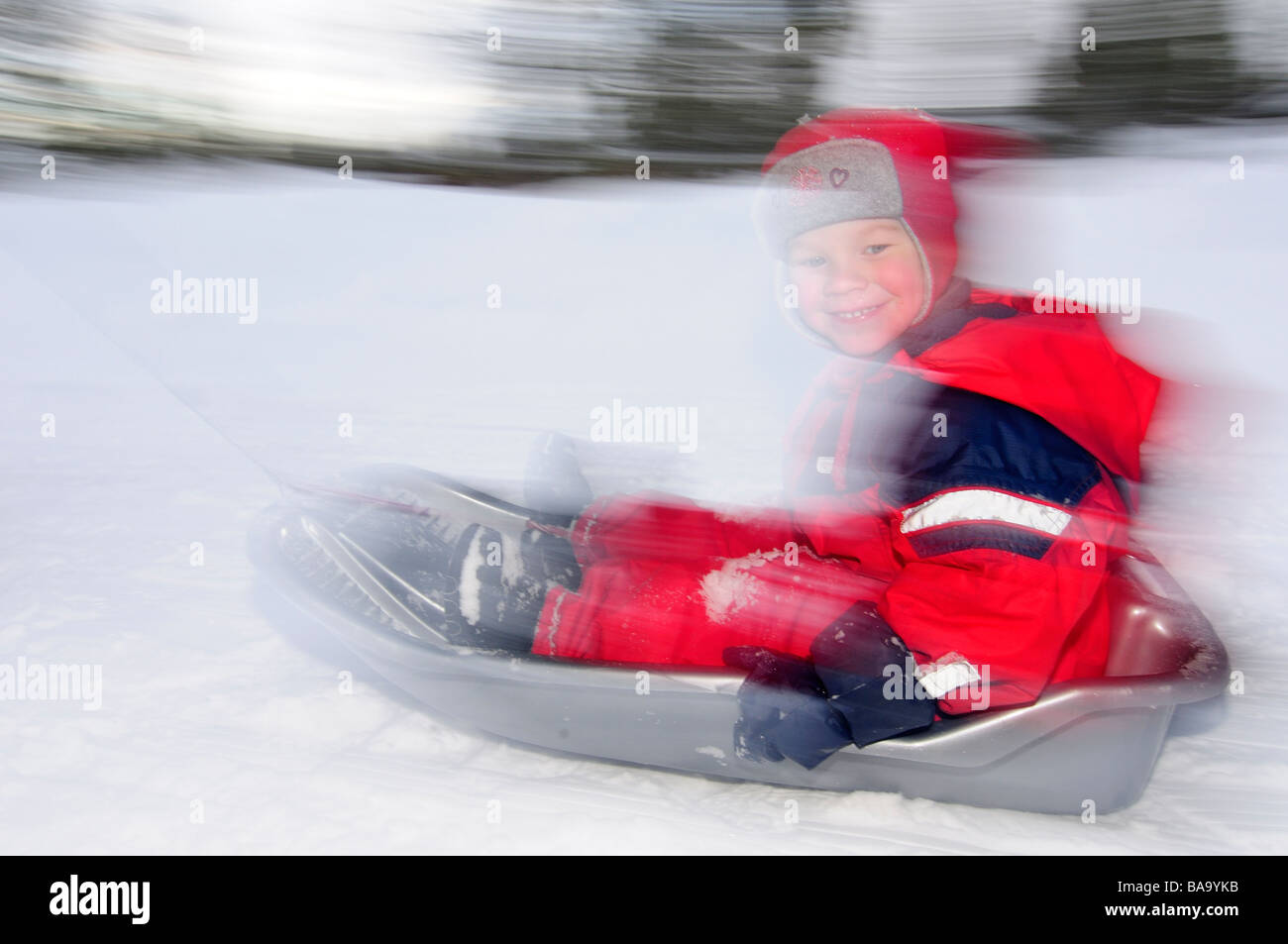 A child in a little sledge Harjedalen Sweden Stock Photo - Alamy
