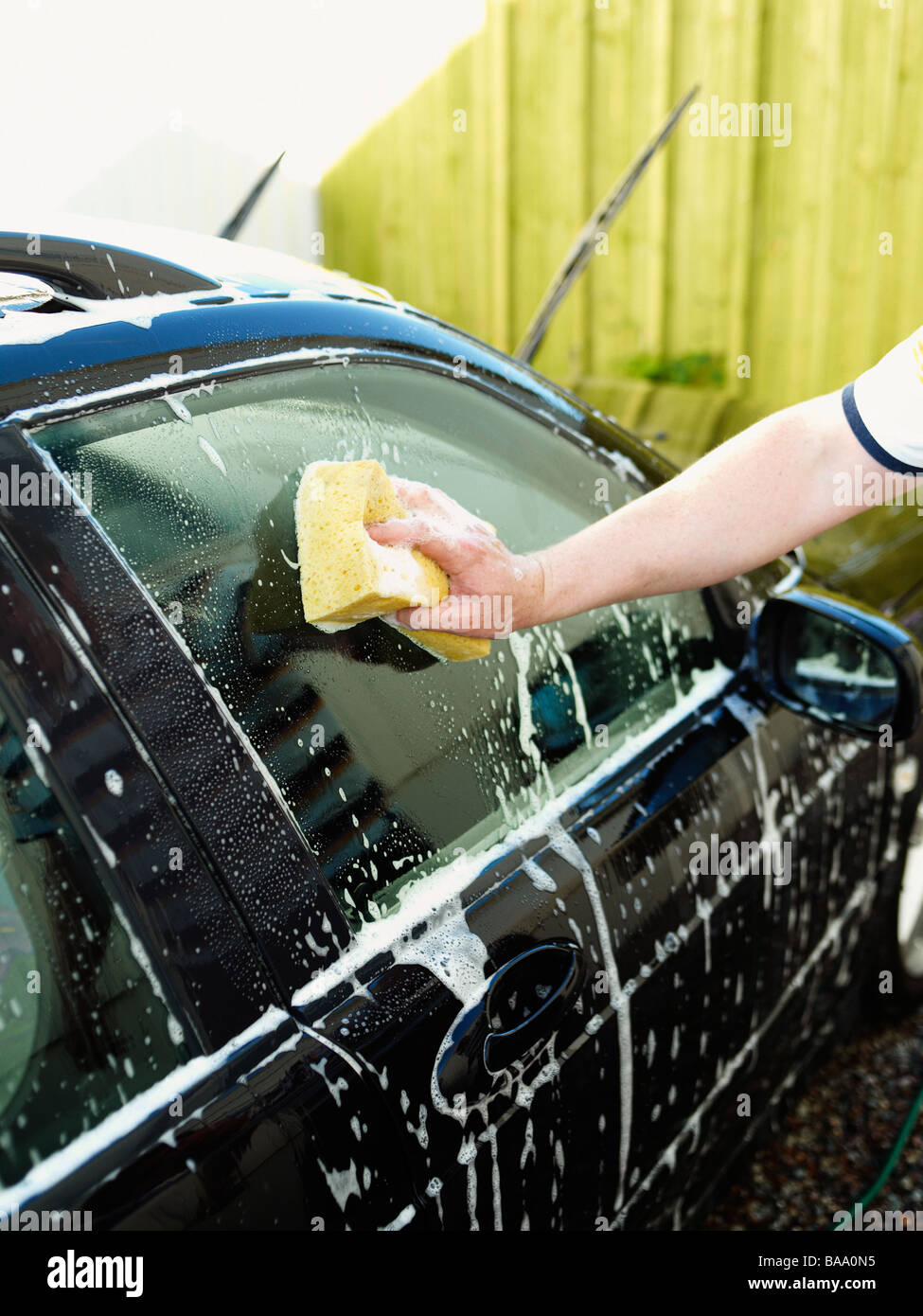 A man washing a car, Sweden Stock Photo - Alamy