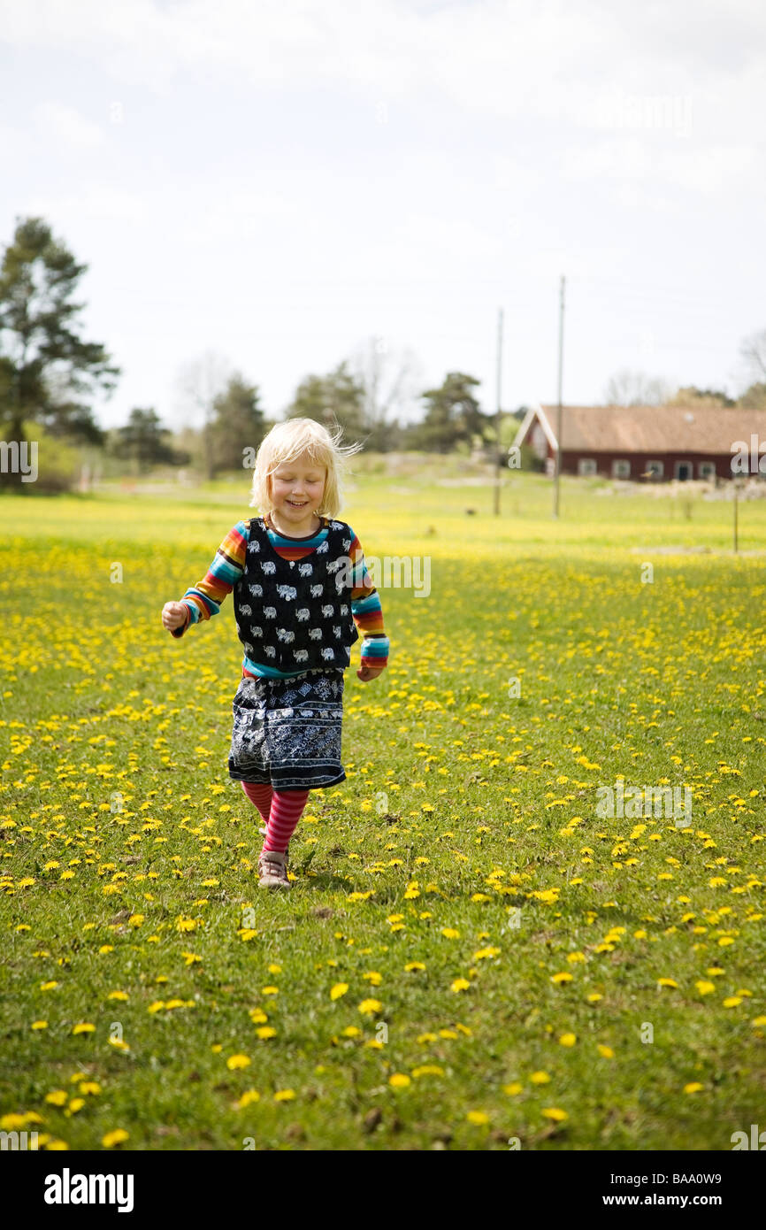 A girl running in a meadow, Varmdo, Sweden Stock Photo - Alamy