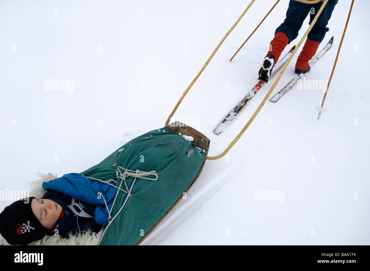 A sleeping child in a little sledge Stock Photo - Alamy