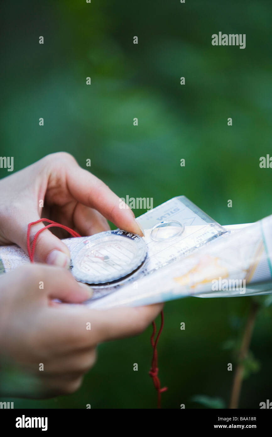 A hand and a compass, Sweden Stock Photo - Alamy