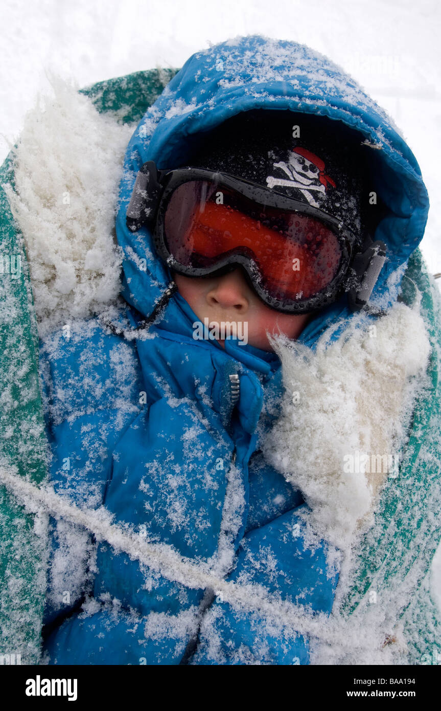 A sleeping child in a little sledge Stock Photo - Alamy