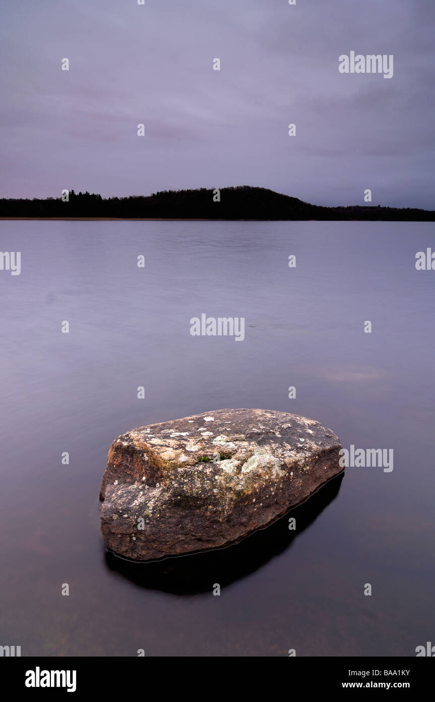 A rock in a lake Sweden Stock Photo - Alamy
