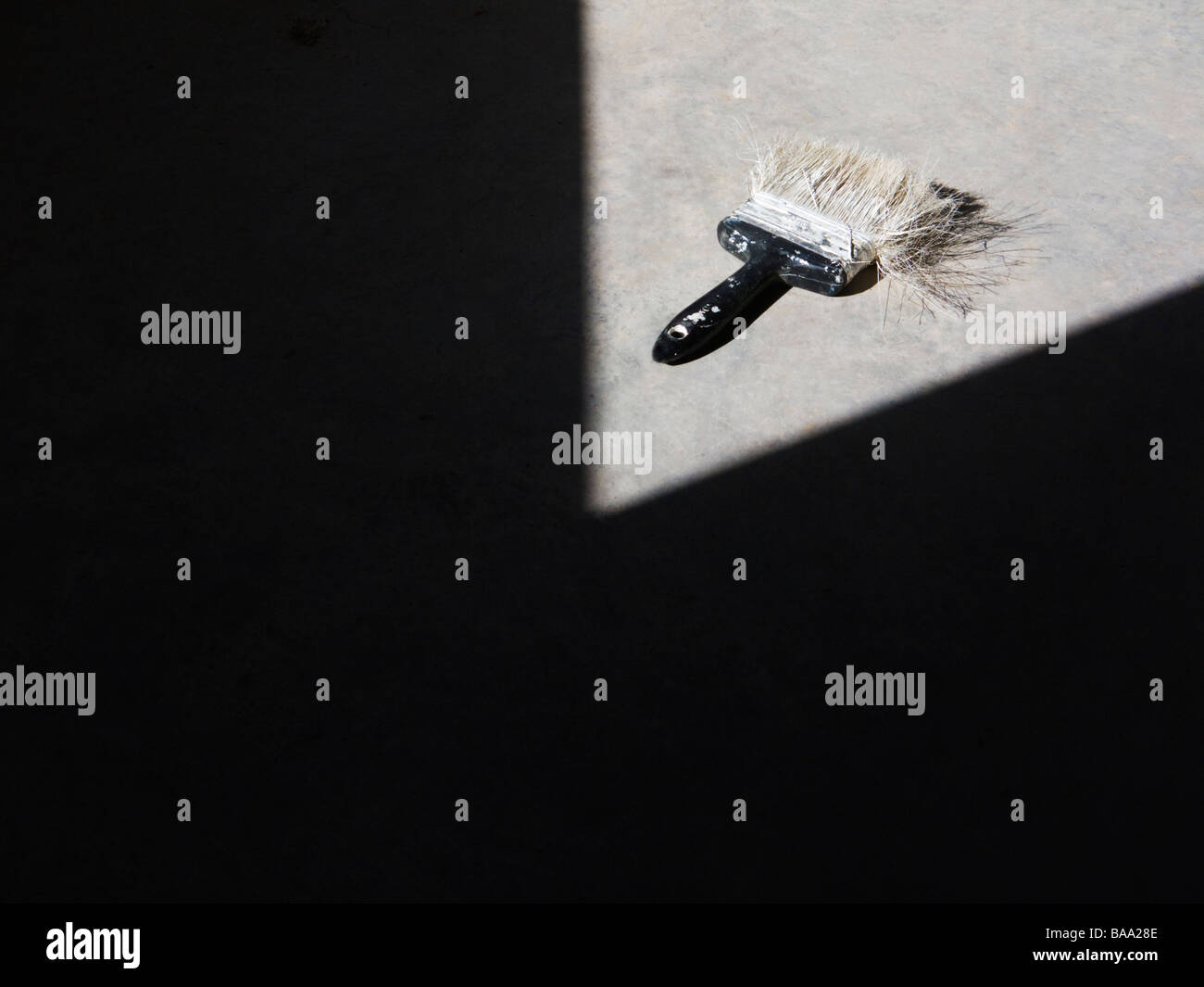 Old paintbrush on concrete floor Stock Photo - Alamy