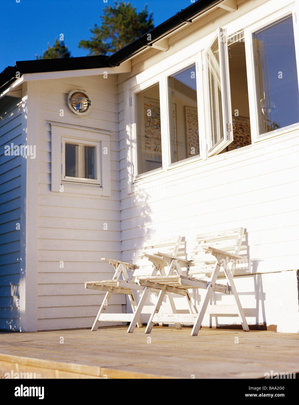 Sun chairs standing by a house wall, Roslagen, Sweden Stock Photo - Alamy