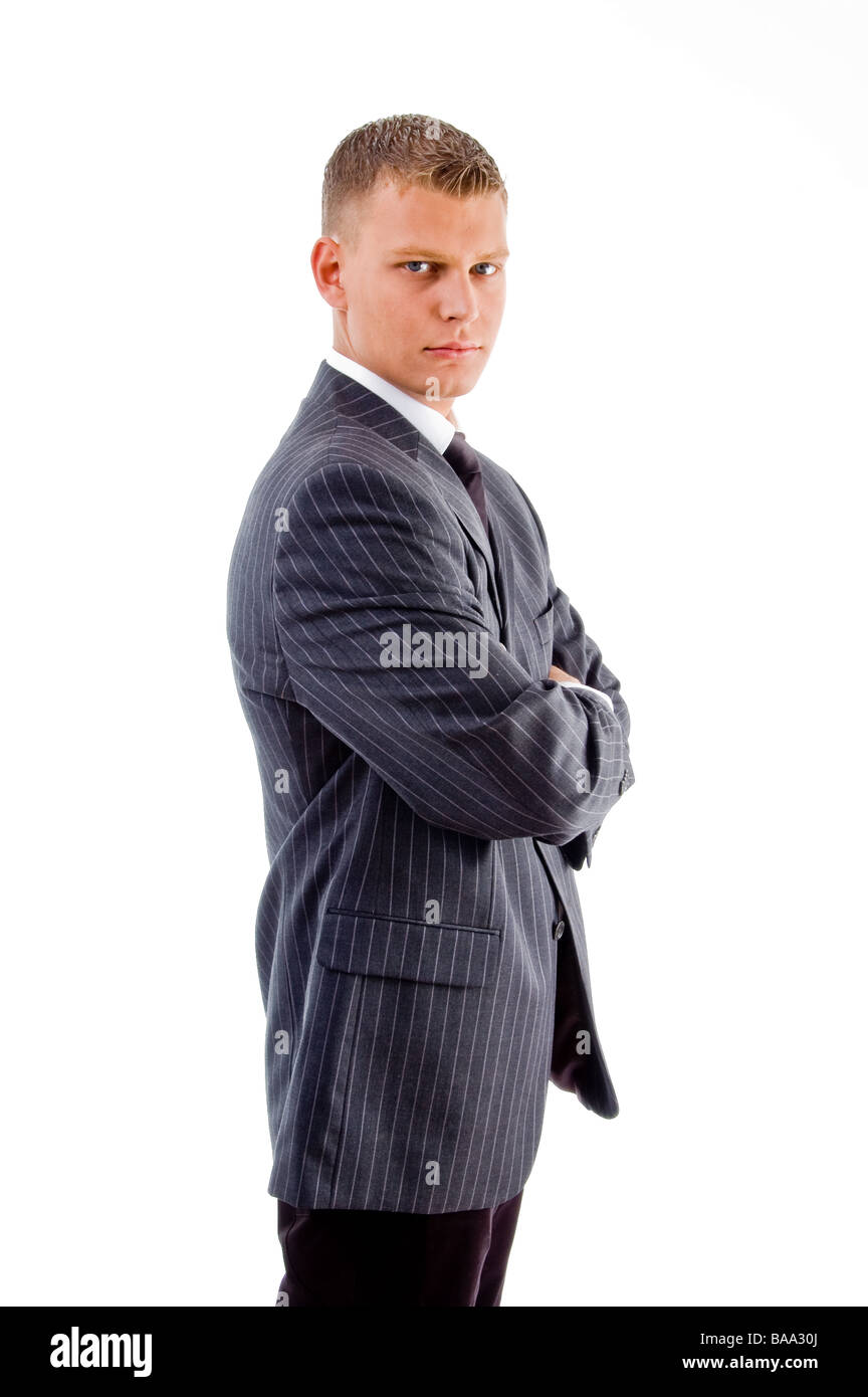 side view of young boss with crossed arms Stock Photo - Alamy