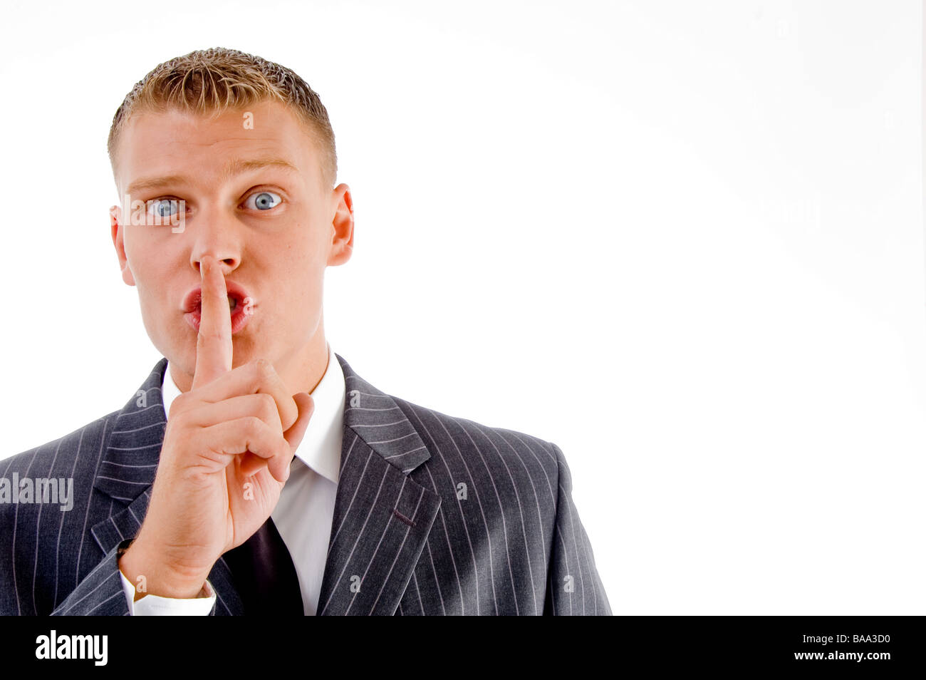 portrait of executive shushing quite Stock Photo - Alamy
