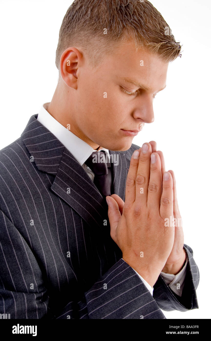 side pose of praying businessman Stock Photo - Alamy