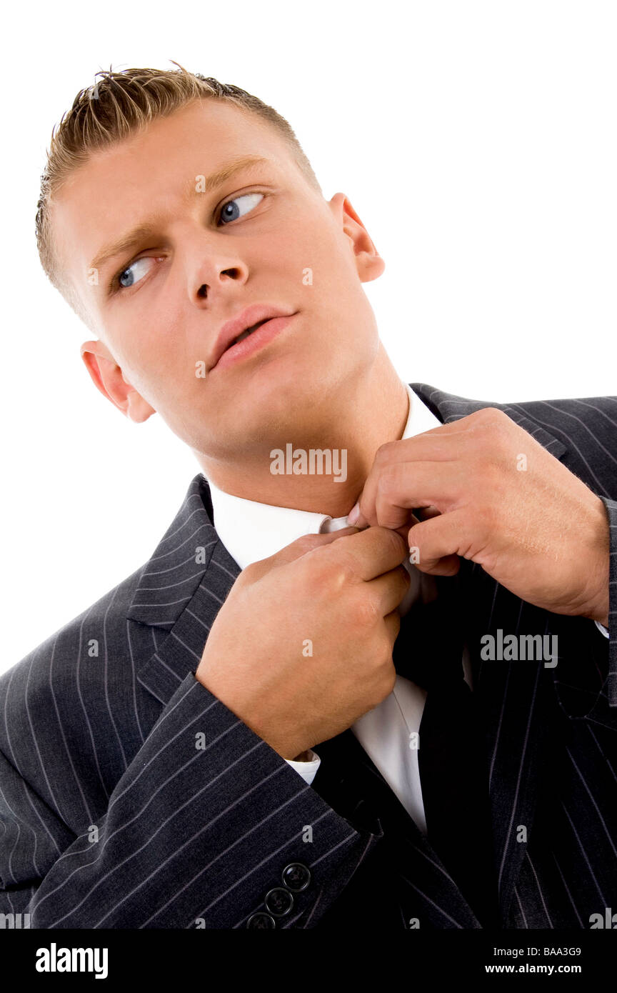 corner view of businessman tucking his button Stock Photo - Alamy