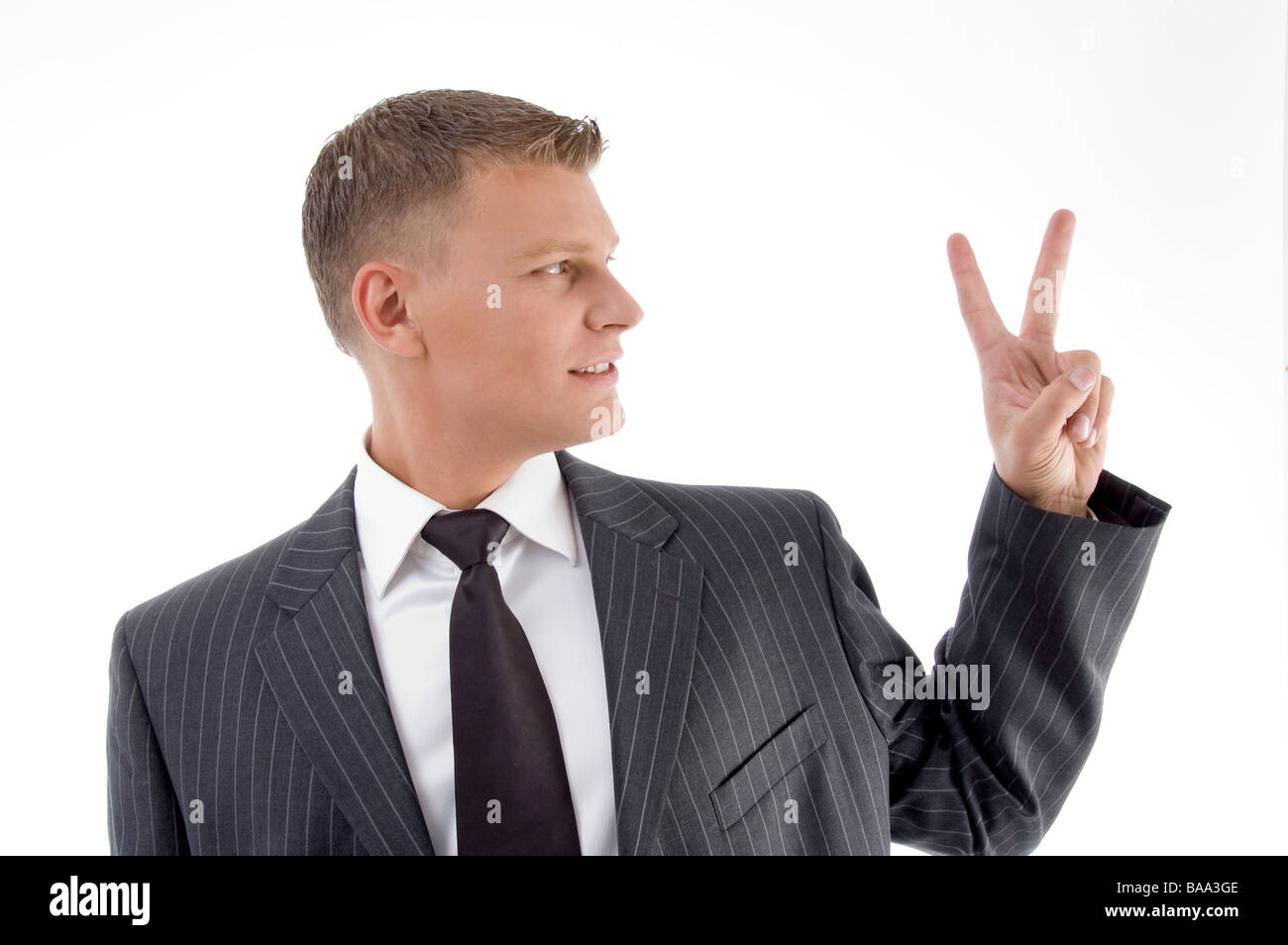 portrait of businessman showing peace sign Stock Photo - Alamy