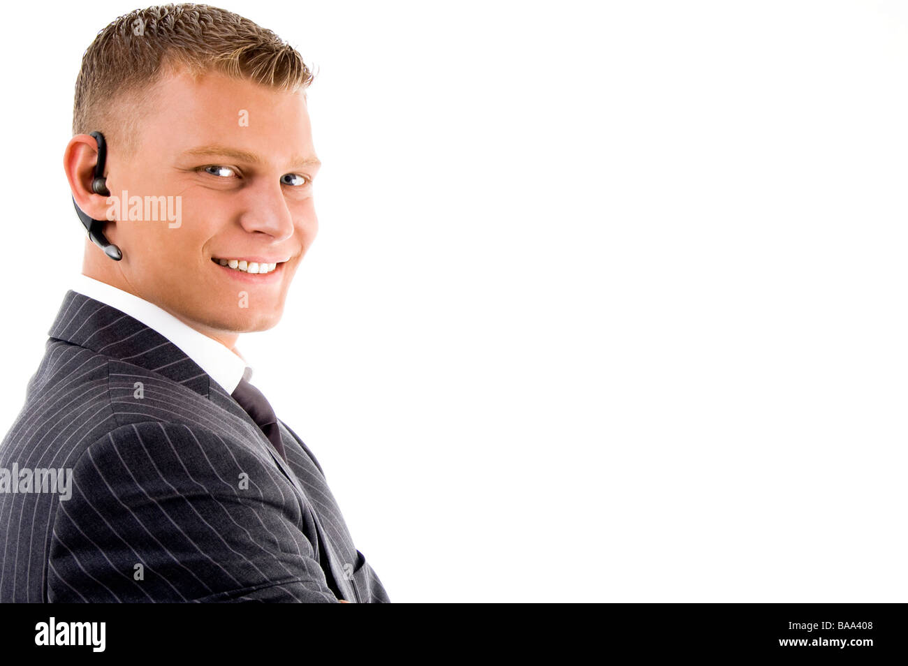 smiling man listening with bluetooth Stock Photo - Alamy