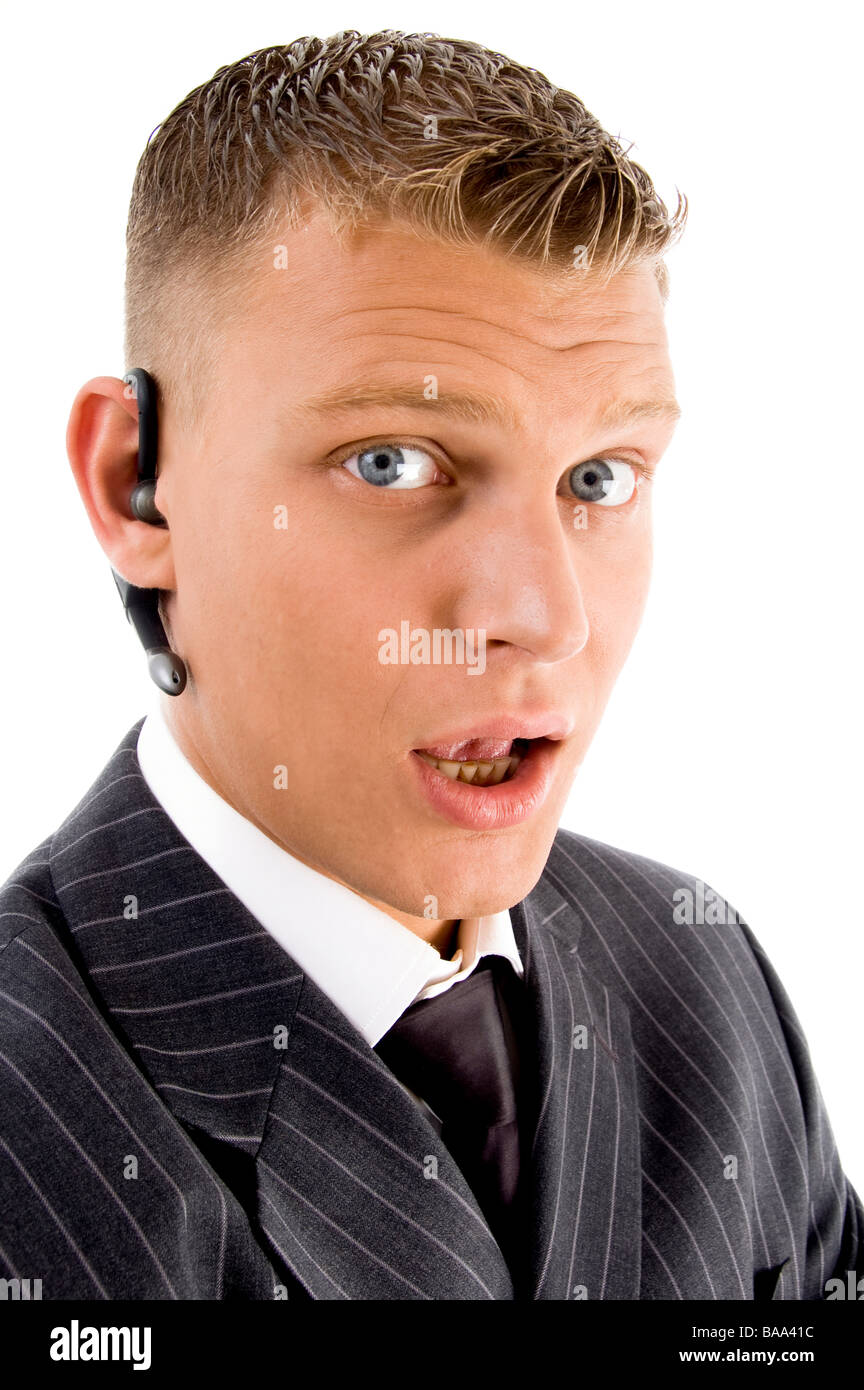 handsome professional guy wearing bluetooth with facial expressi Stock ...