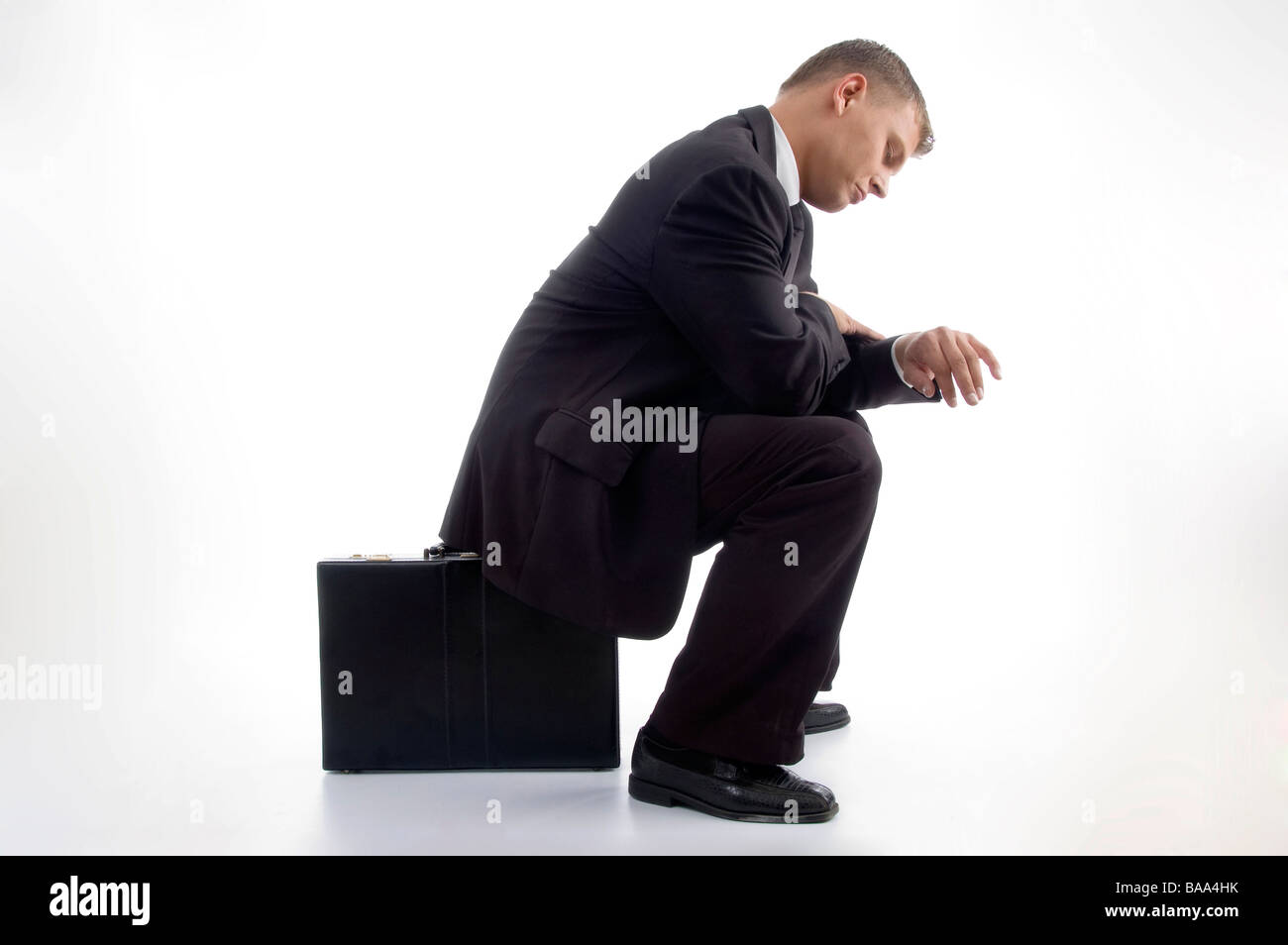 young accountant having a look at his watch Stock Photo - Alamy