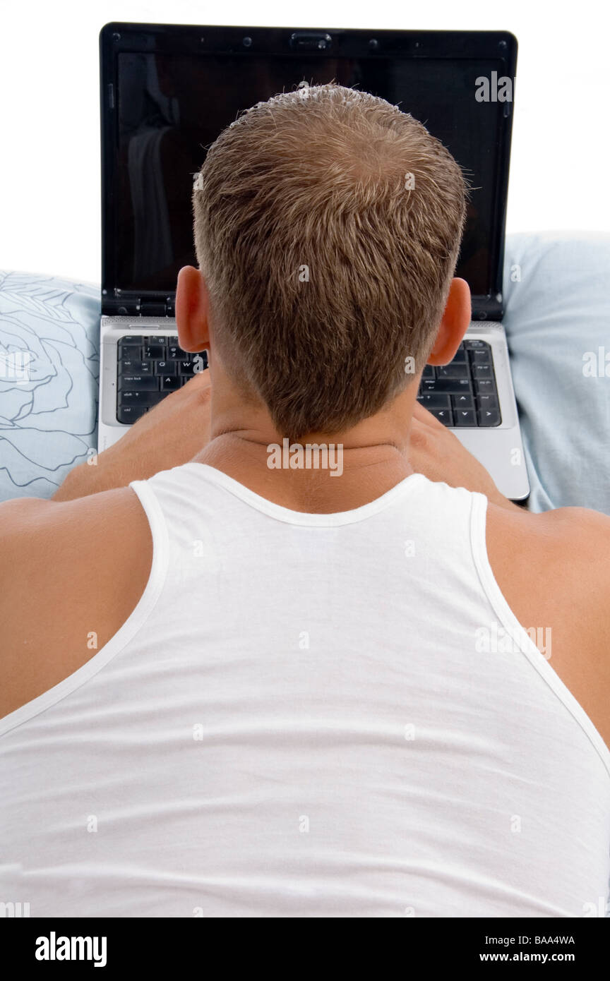 back pose of man working on laptop Stock Photo - Alamy